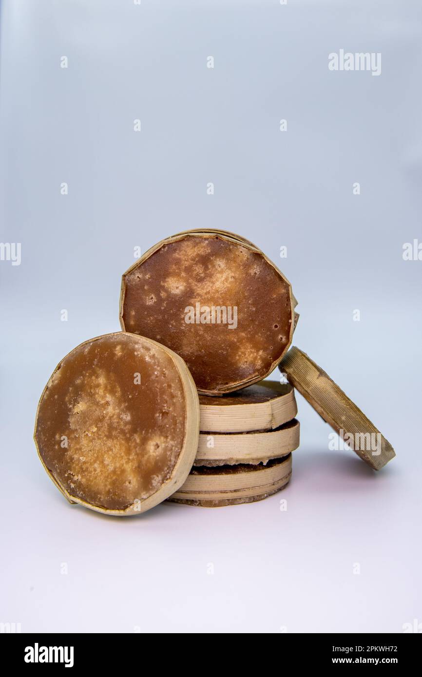 The palm jaggery isolated on white background Stock Photo - Alamy