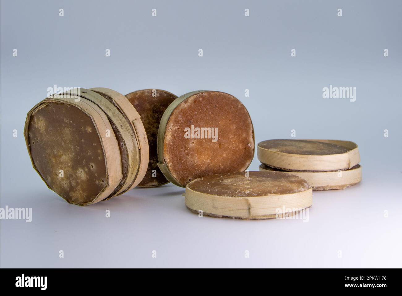 The palm jaggery isolated on white background Stock Photo - Alamy