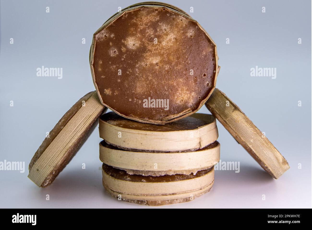 The palm jaggery isolated on white background Stock Photo - Alamy