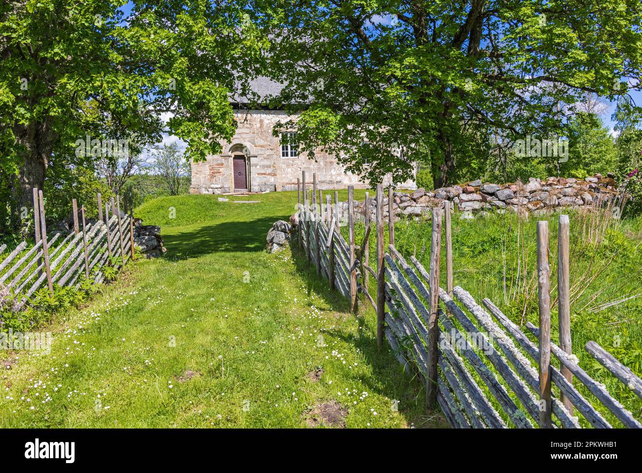 Footpath with wooden pole fence to Suntak's old church in Sweden Stock ...