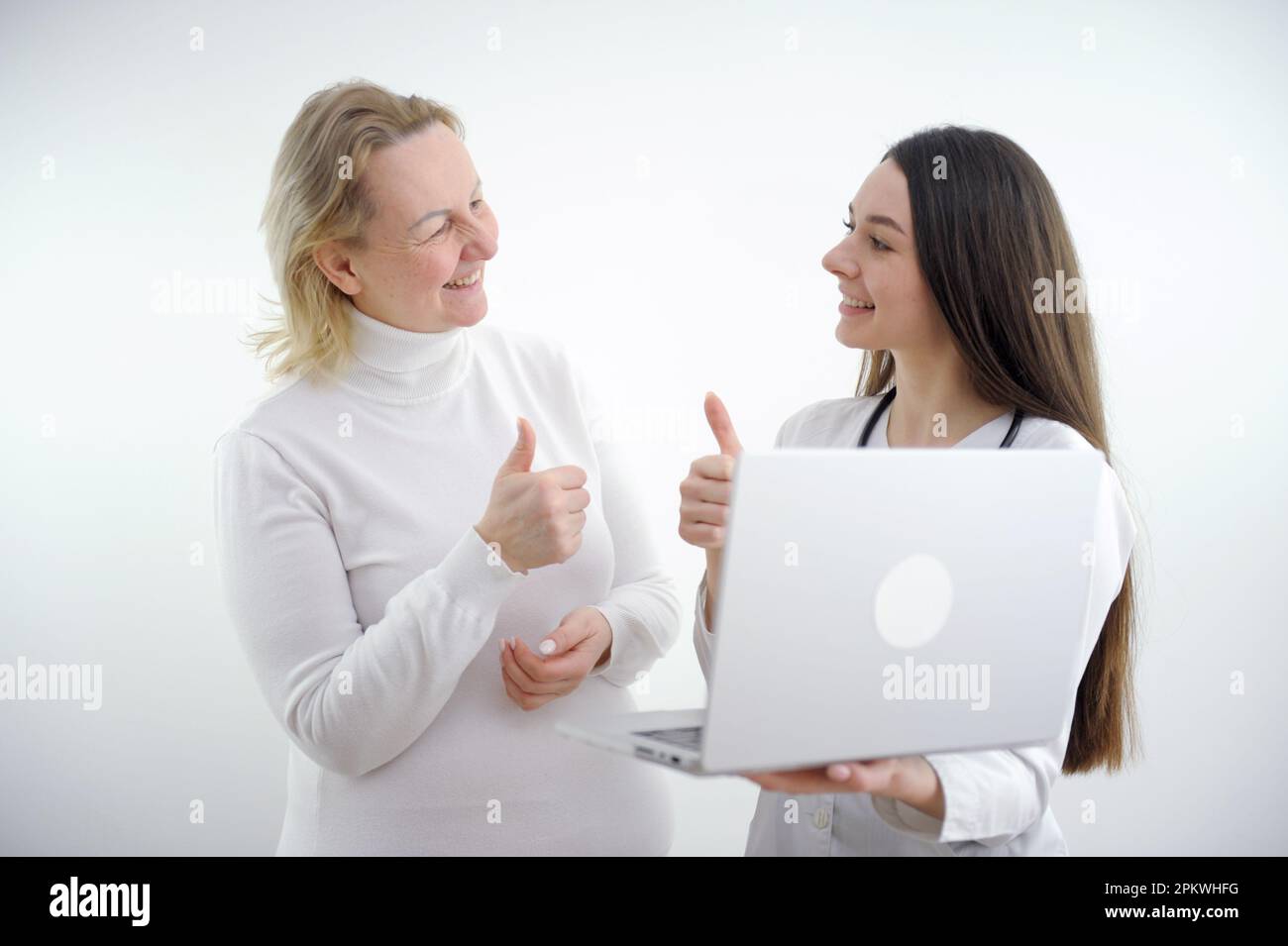young female patient on bed showing thumbs up with smiley face very ...