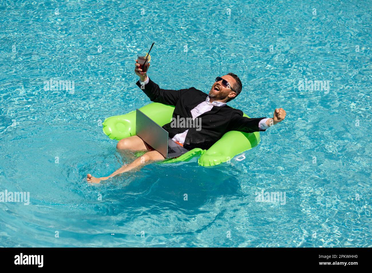 Handsome man floating in pool hi-res stock photography and images - Alamy