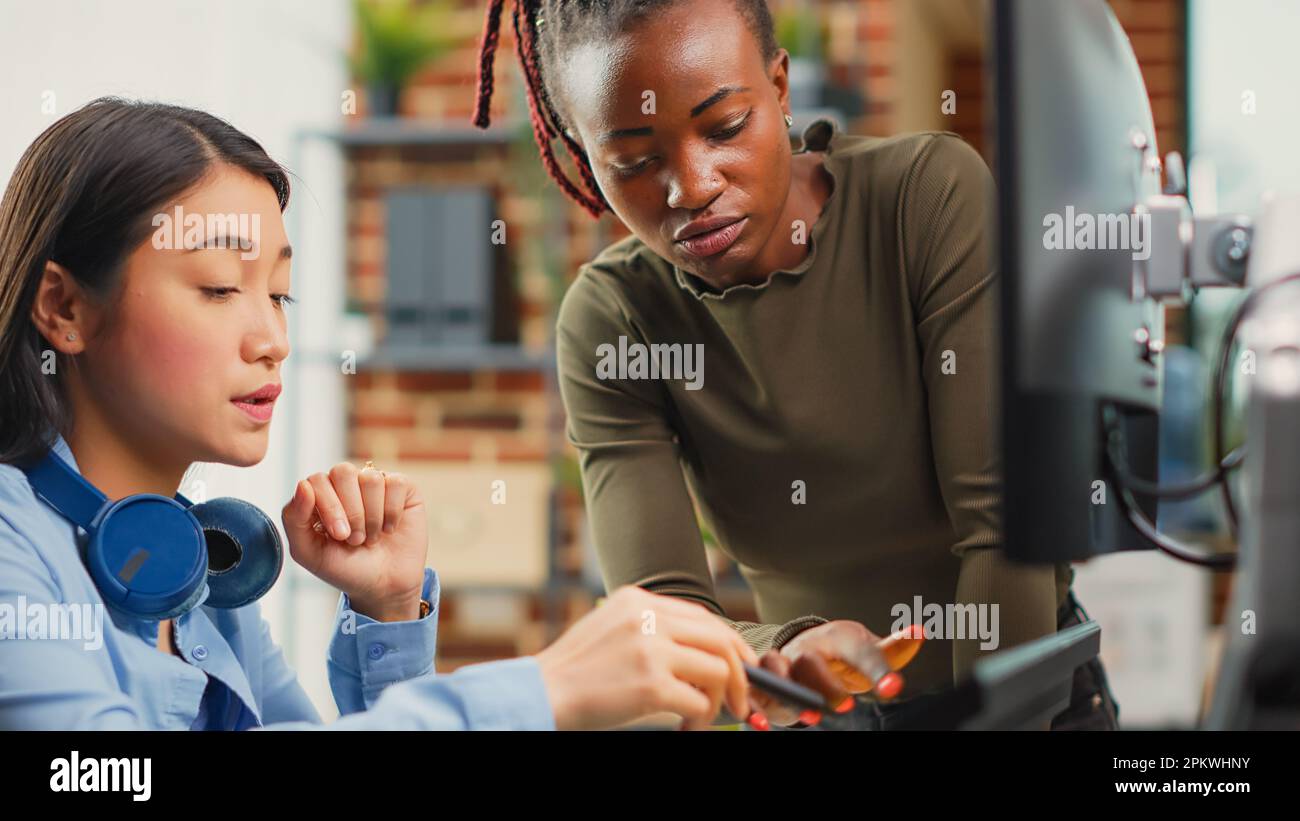 Creative agency diverse people retouching photos using digital editing ...