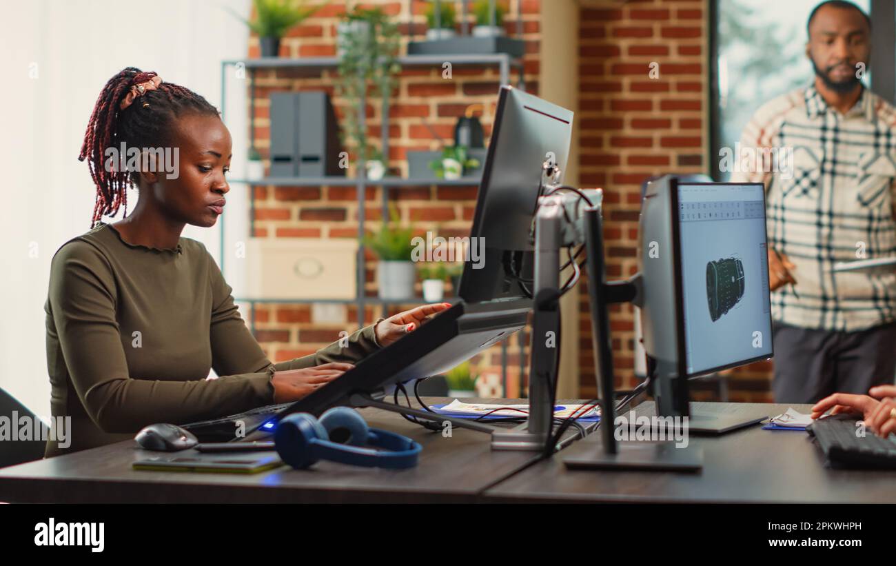 Diverse coworkers working on software development on multi monitors ...