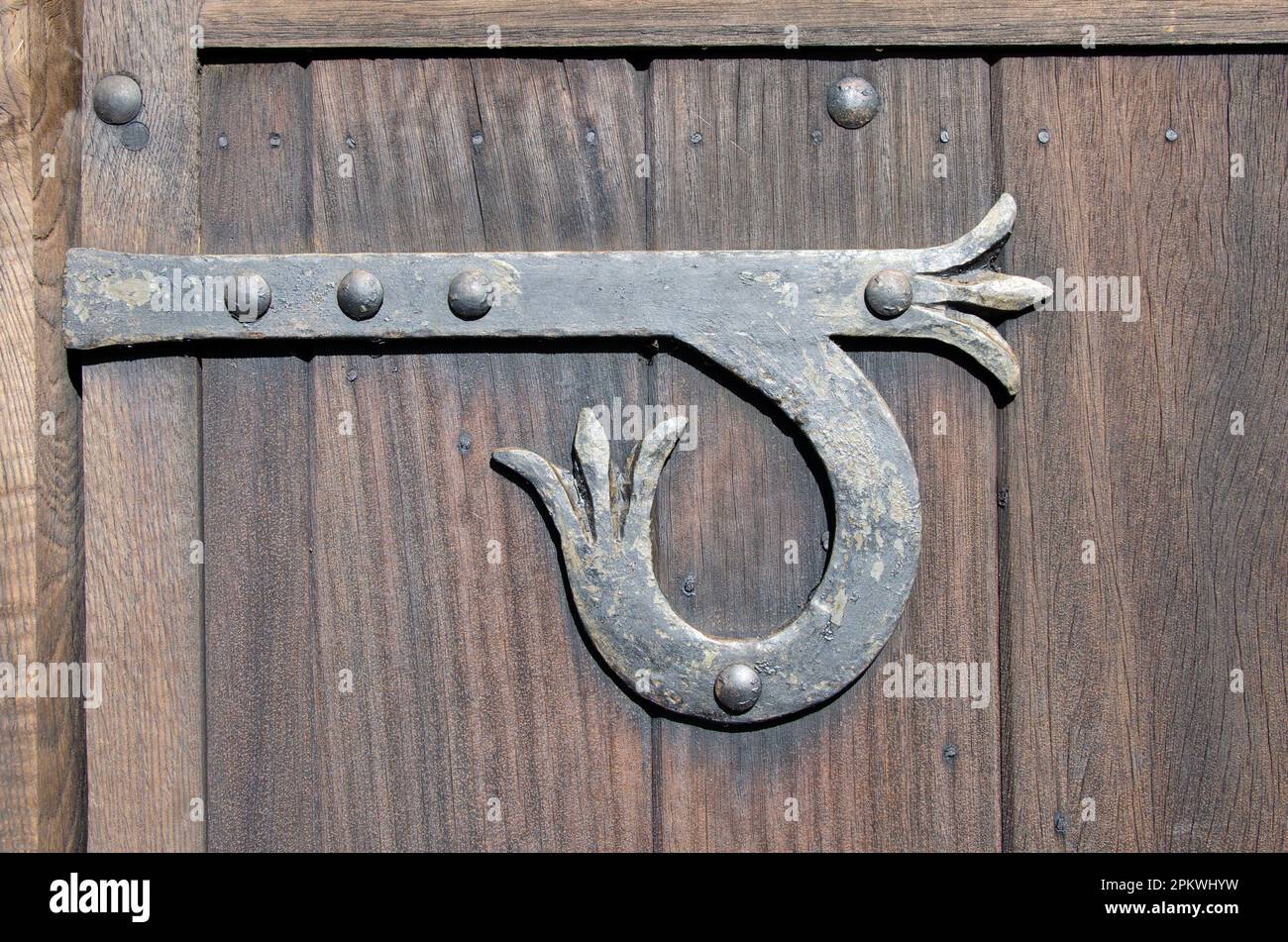Close-up of decorative steel gate hinge Stock Photo - Alamy