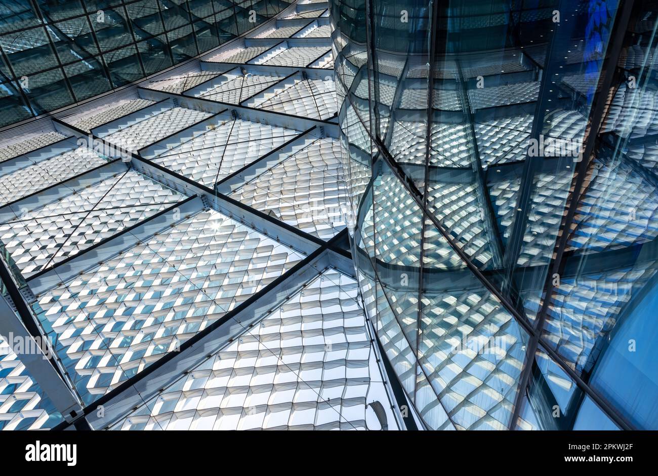 The geometry of modern urban architecture is reflected in the glass ...