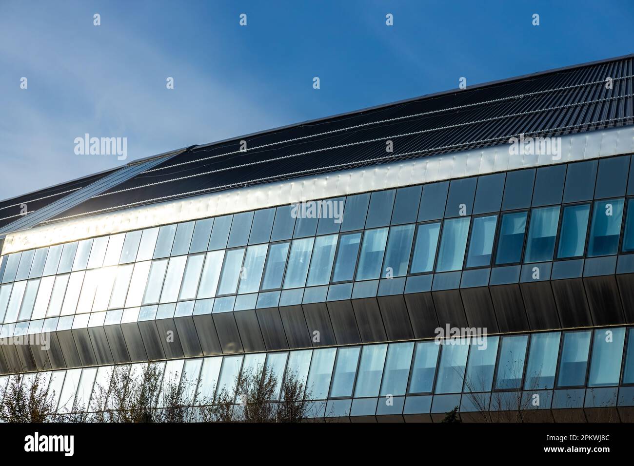 The geometry of modern urban architecture is reflected in the glass ...