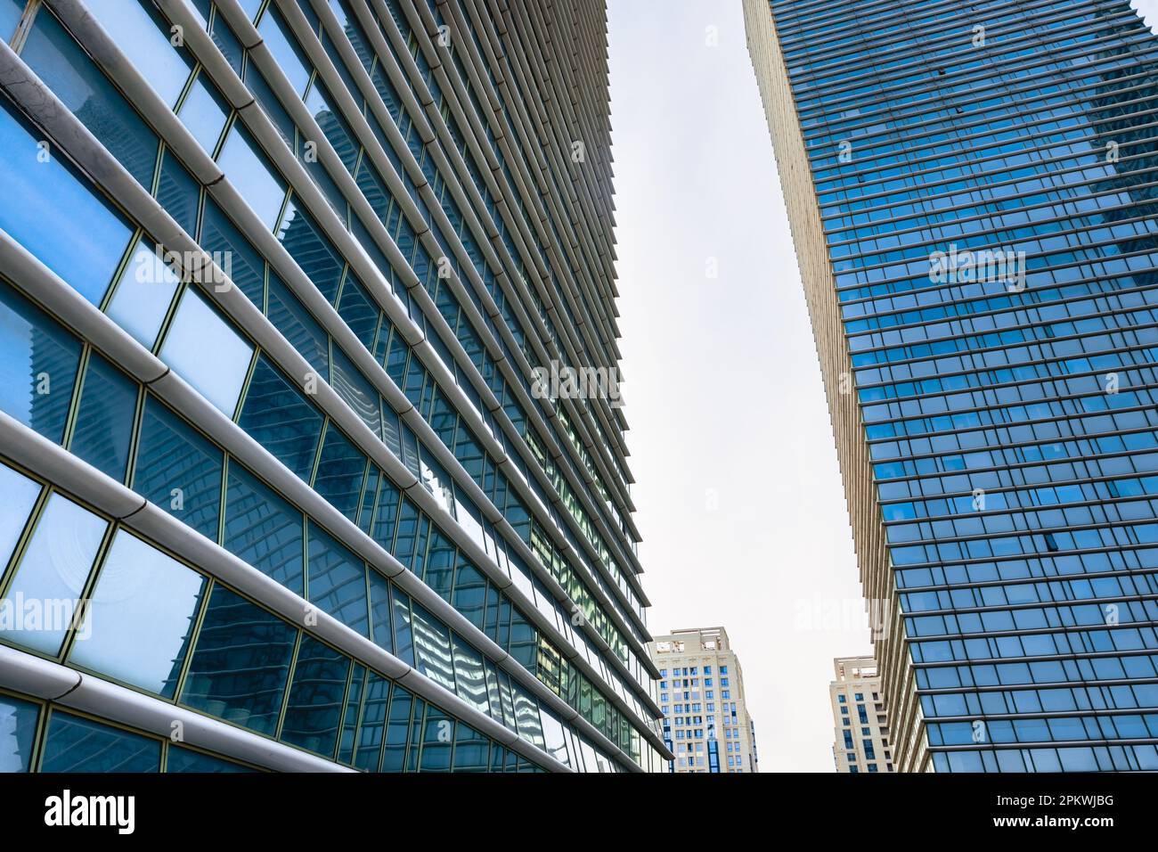 The geometry of modern urban architecture is reflected in the glass ...