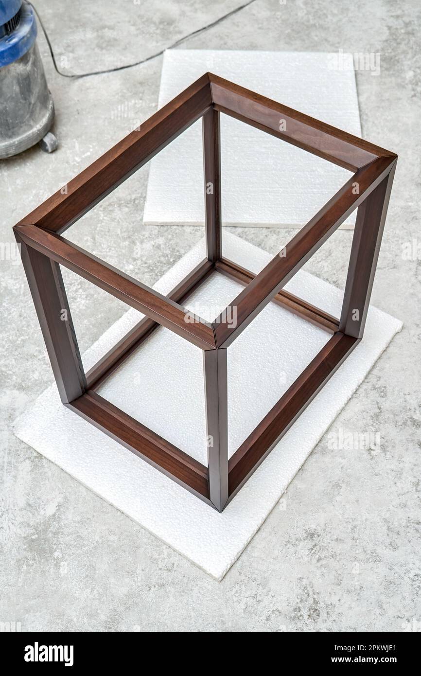 Wooden frame of bedside table made of solid walnut in workshop. Joinery ...