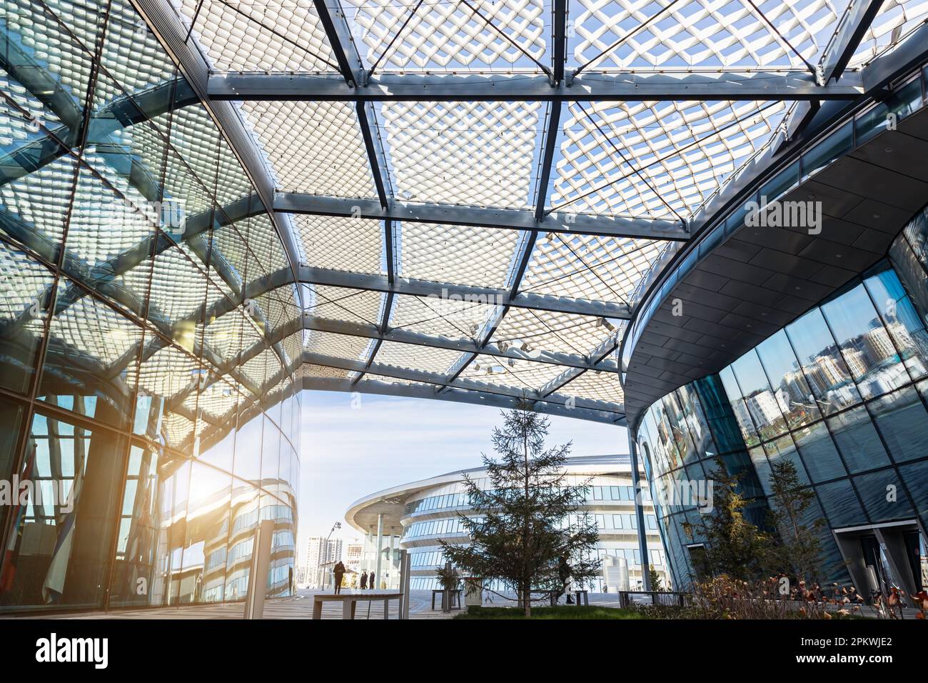 The geometry of modern urban architecture is reflected in the glass ...