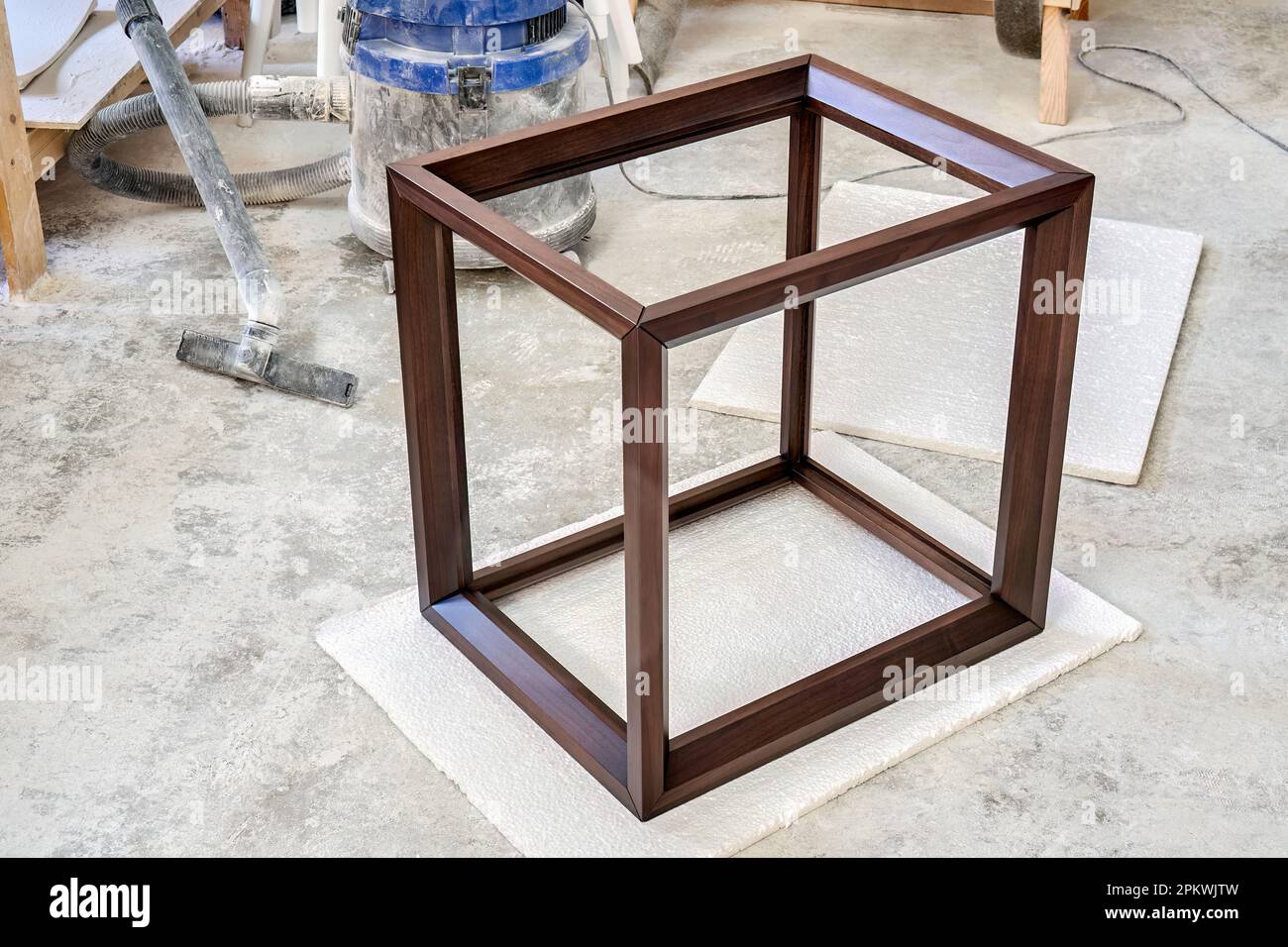 Wooden frame of bedside table made of solid walnut in workshop. Joinery ...