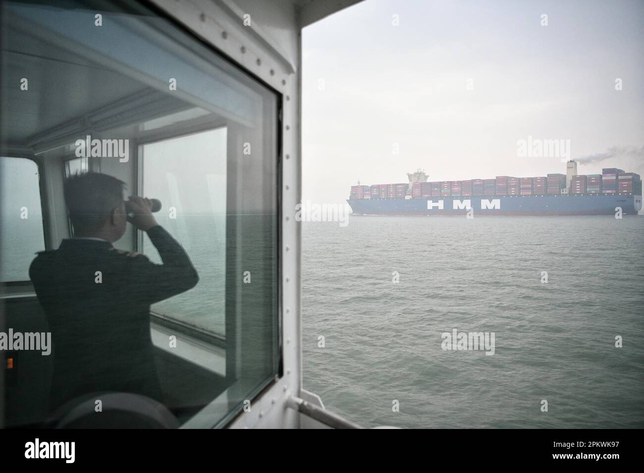 **CHINESE MAINLAND, HONG KONG, MACAU AND TAIWAN OUT** A container ship ...