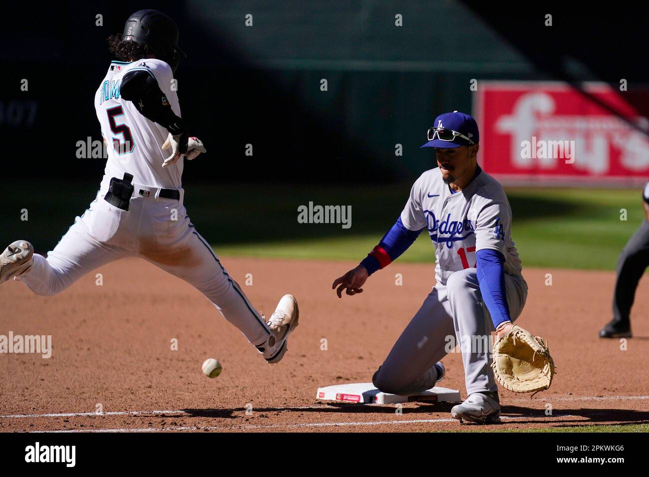 Arizona Diamondbacks' Alek Thomas (5) reaches first base safely as Los ...