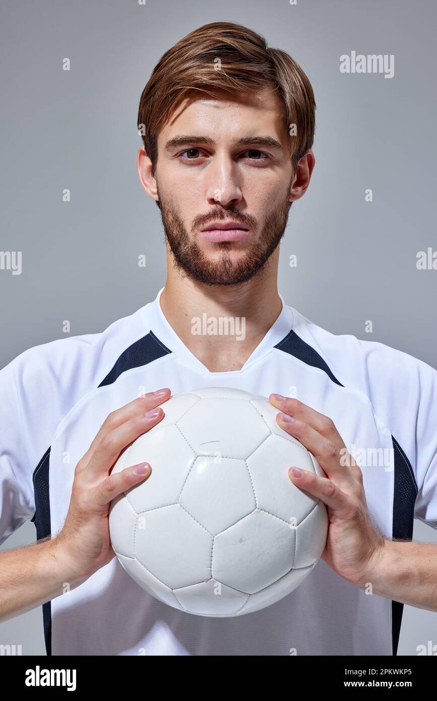 Soccer player studio portrait Stock Photo - Alamy