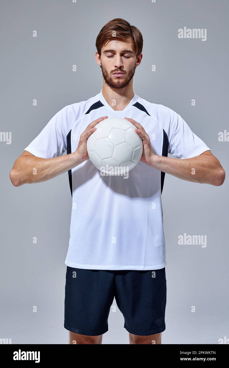 Soccer player studio portrait Stock Photo - Alamy