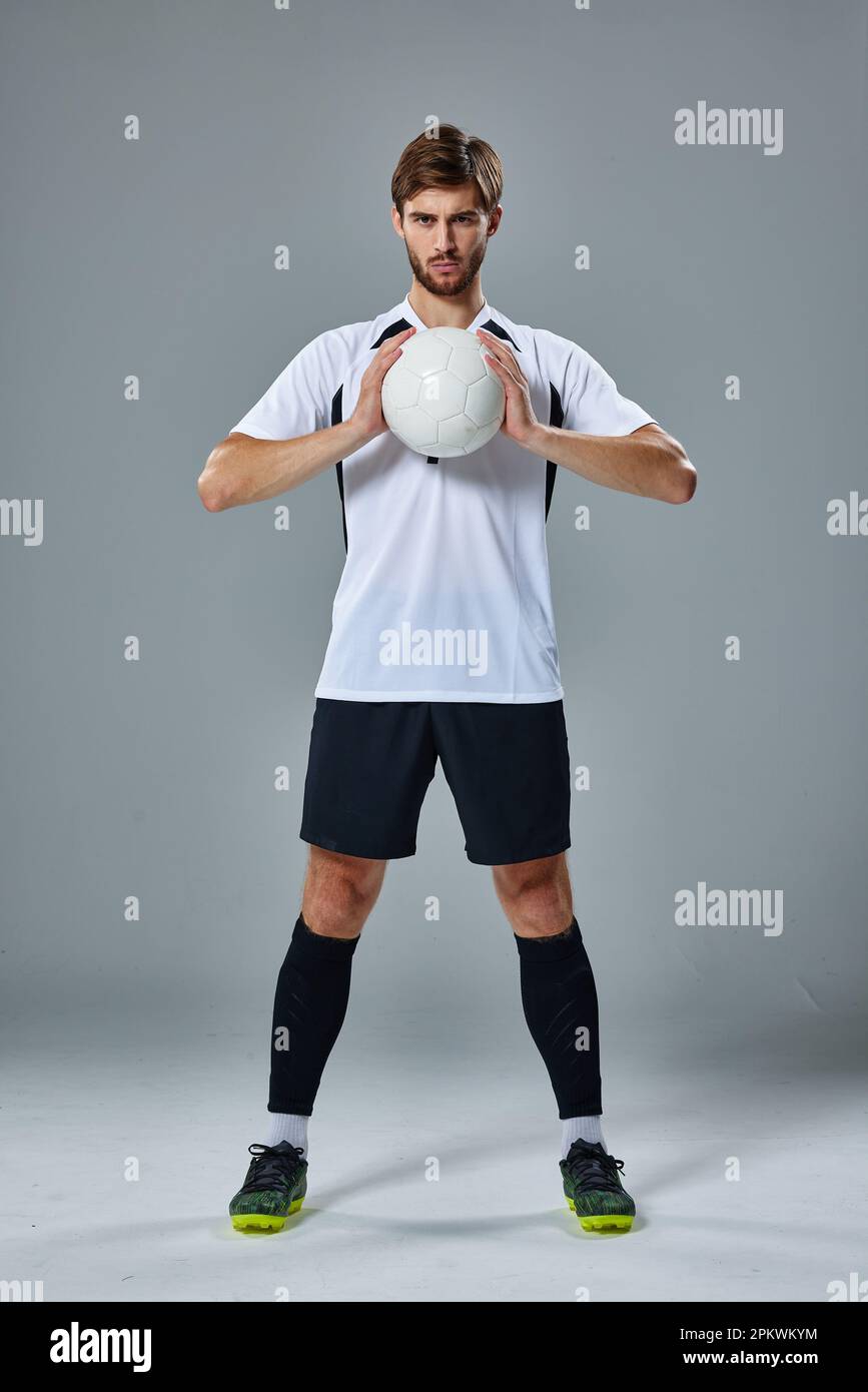 Soccer player studio portrait Stock Photo - Alamy
