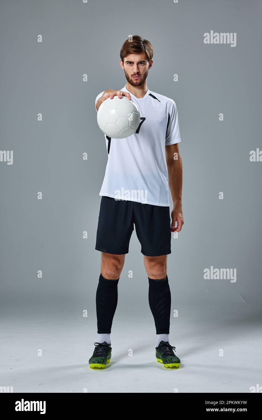 Soccer player studio portrait Stock Photo - Alamy
