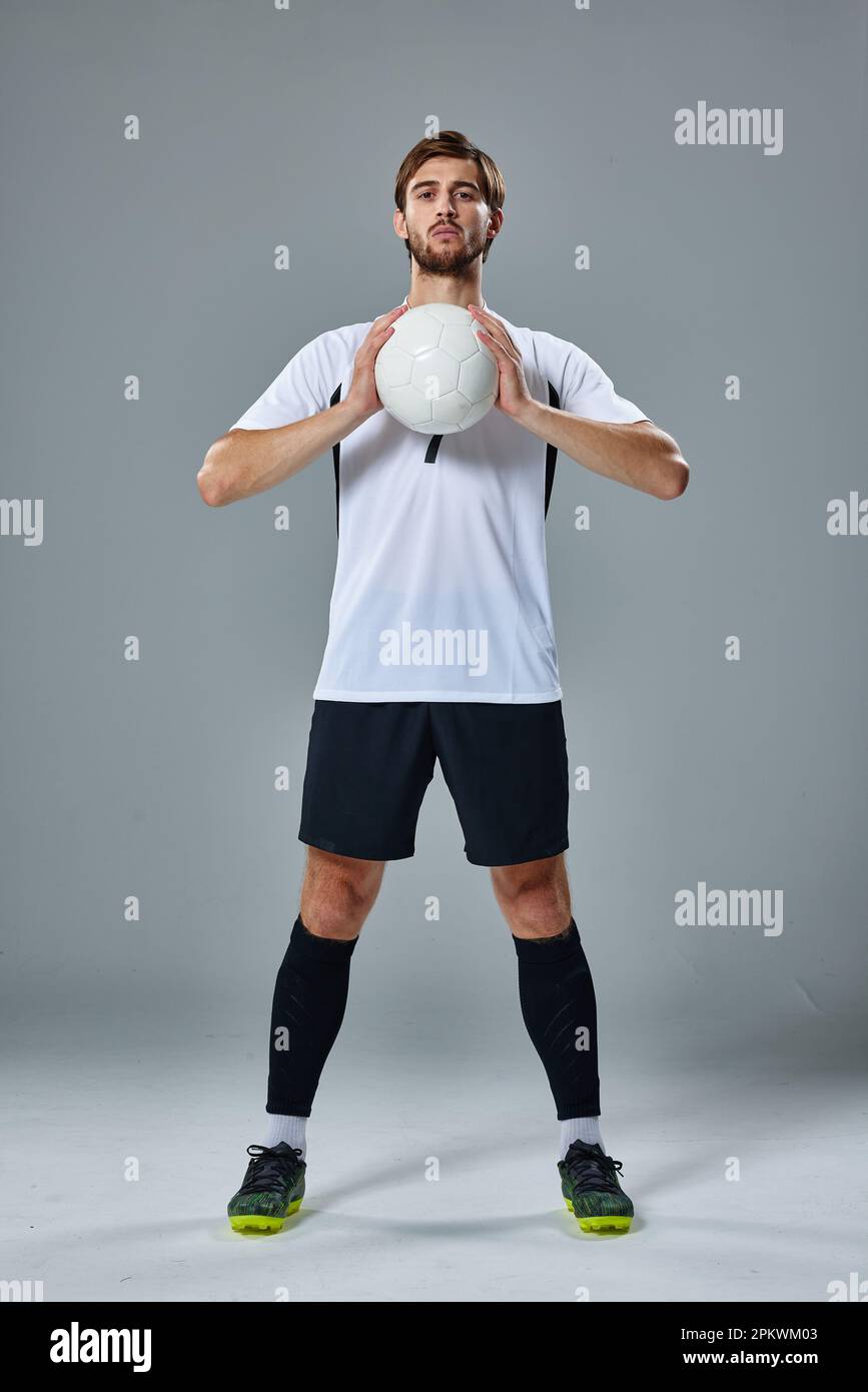 Soccer player studio portrait Stock Photo - Alamy