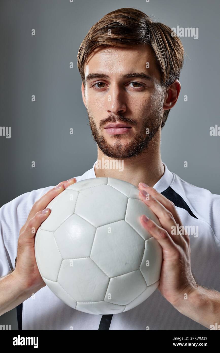 Soccer player studio portrait Stock Photo - Alamy