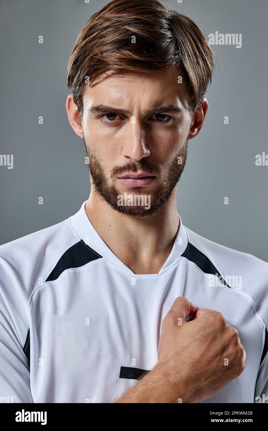 Soccer player studio portrait Stock Photo - Alamy