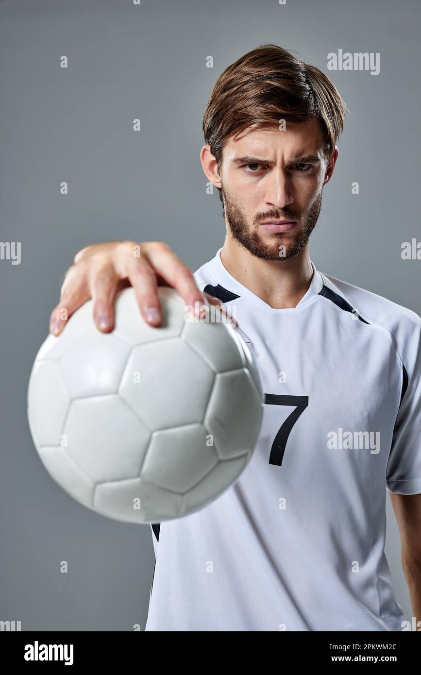 Soccer player studio portrait Stock Photo - Alamy