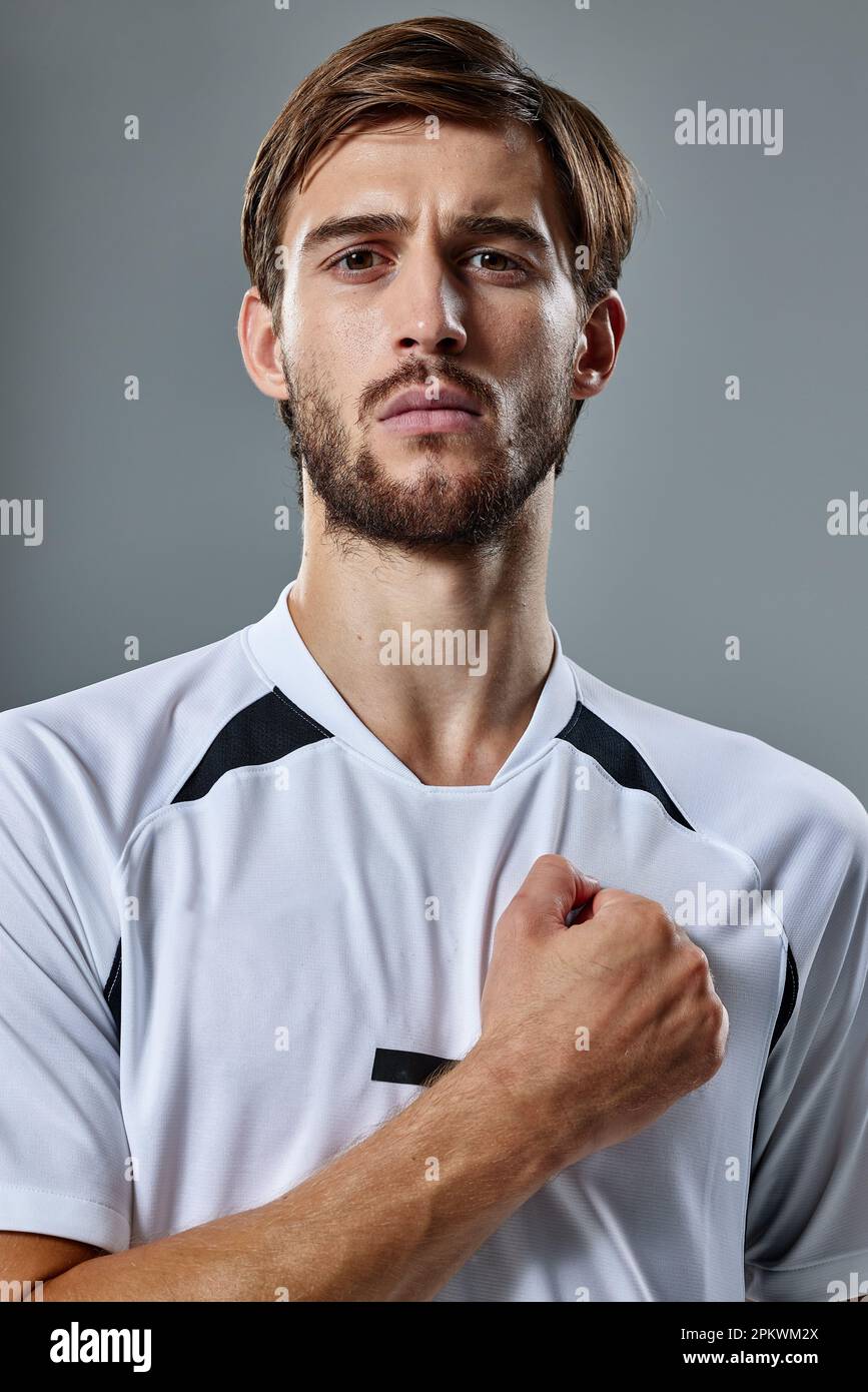 Soccer player studio portrait Stock Photo - Alamy