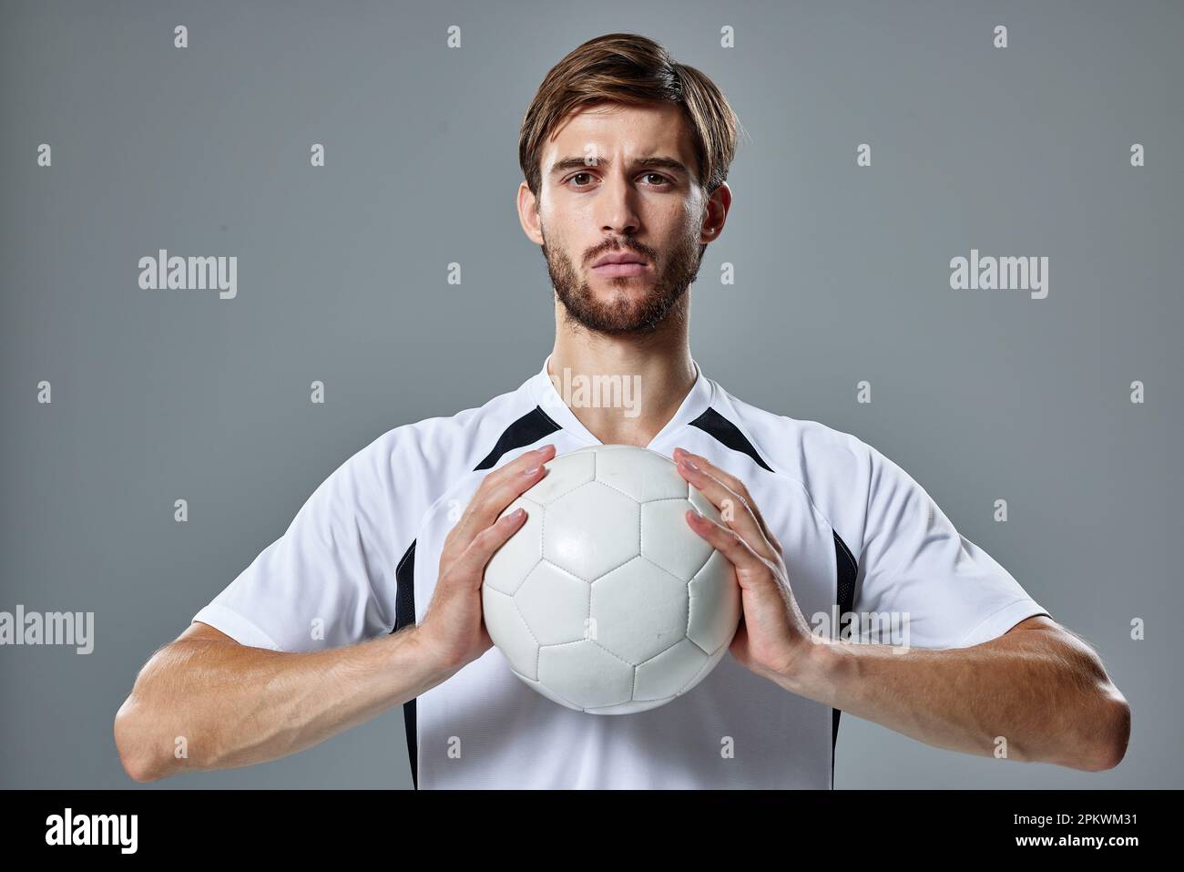 Soccer player studio portrait Stock Photo - Alamy