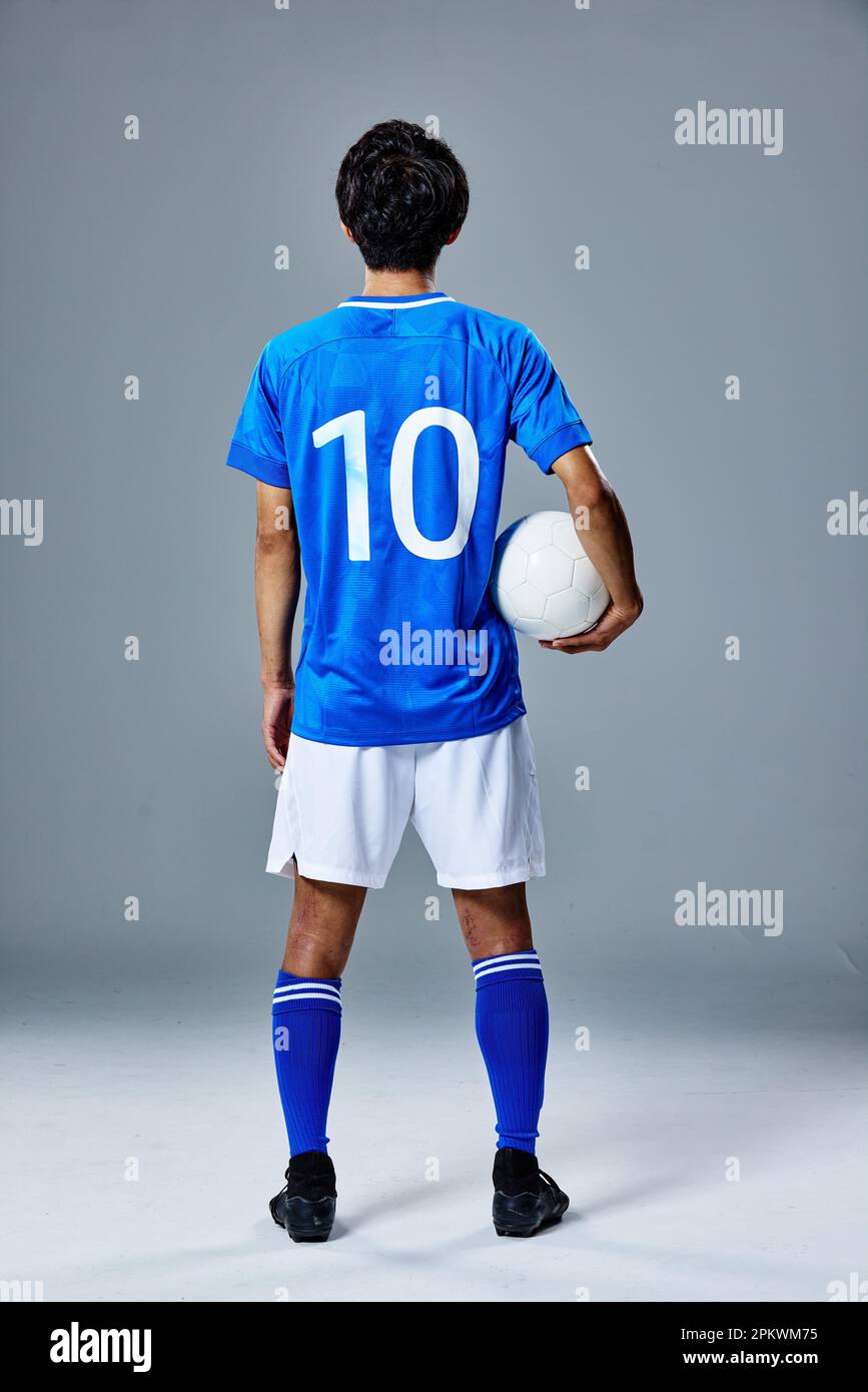 Soccer player studio portrait Stock Photo - Alamy