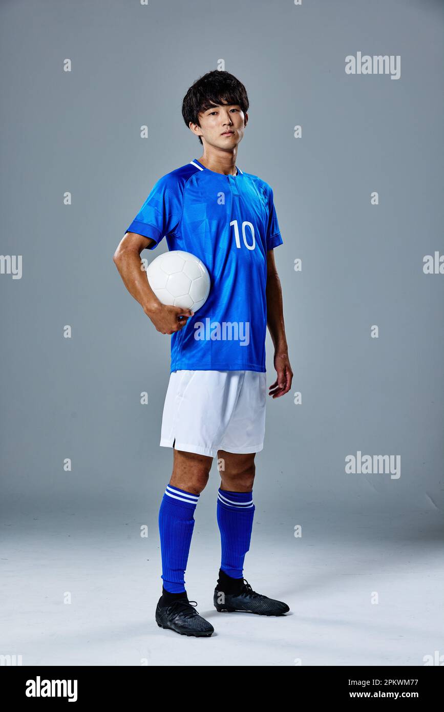 Soccer player studio portrait Stock Photo - Alamy