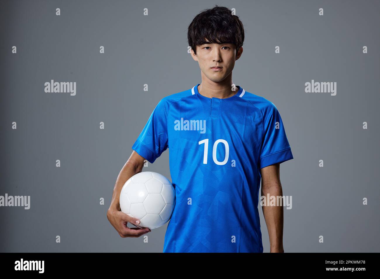 Soccer player studio portrait Stock Photo - Alamy