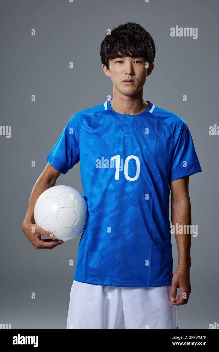 Soccer player studio portrait Stock Photo - Alamy