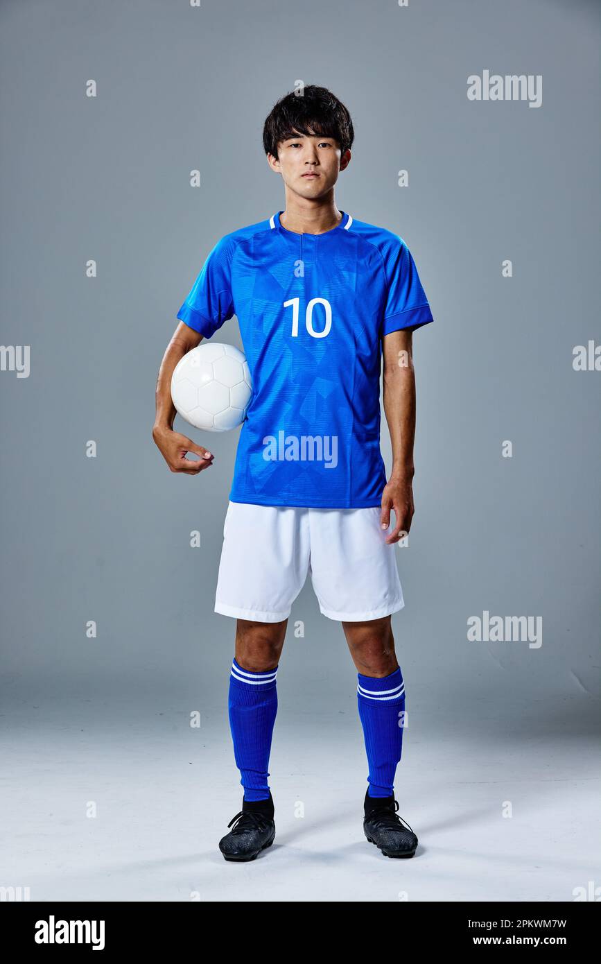 Soccer player studio portrait Stock Photo - Alamy