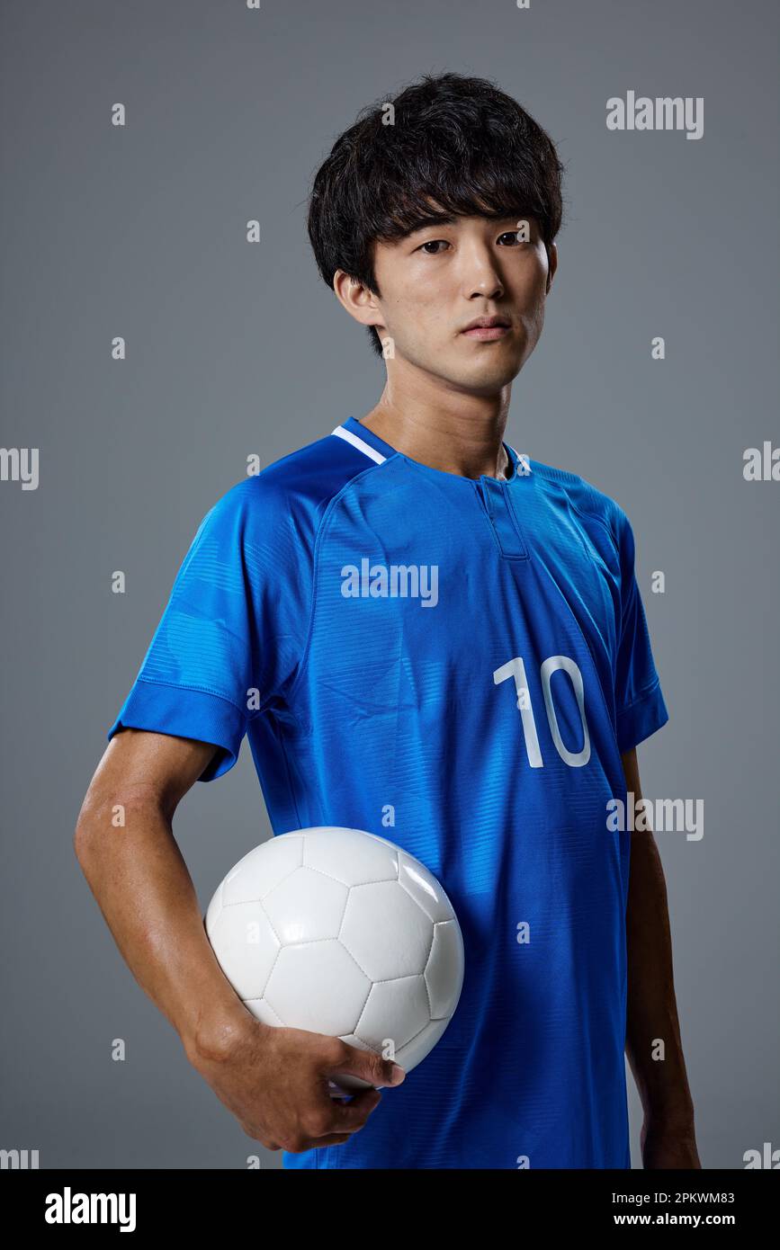 Soccer player studio portrait Stock Photo - Alamy