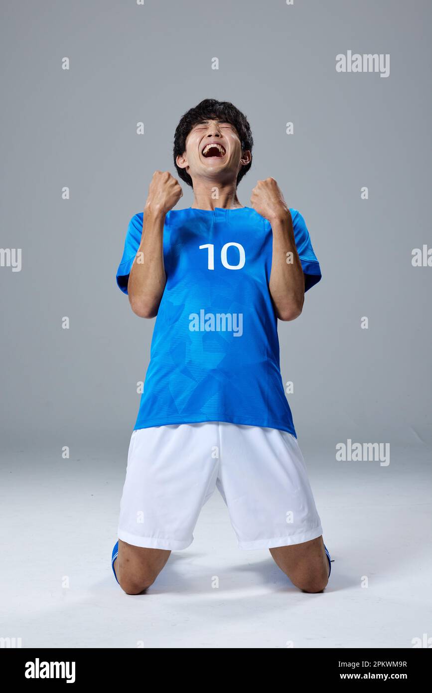 Soccer player studio portrait Stock Photo - Alamy