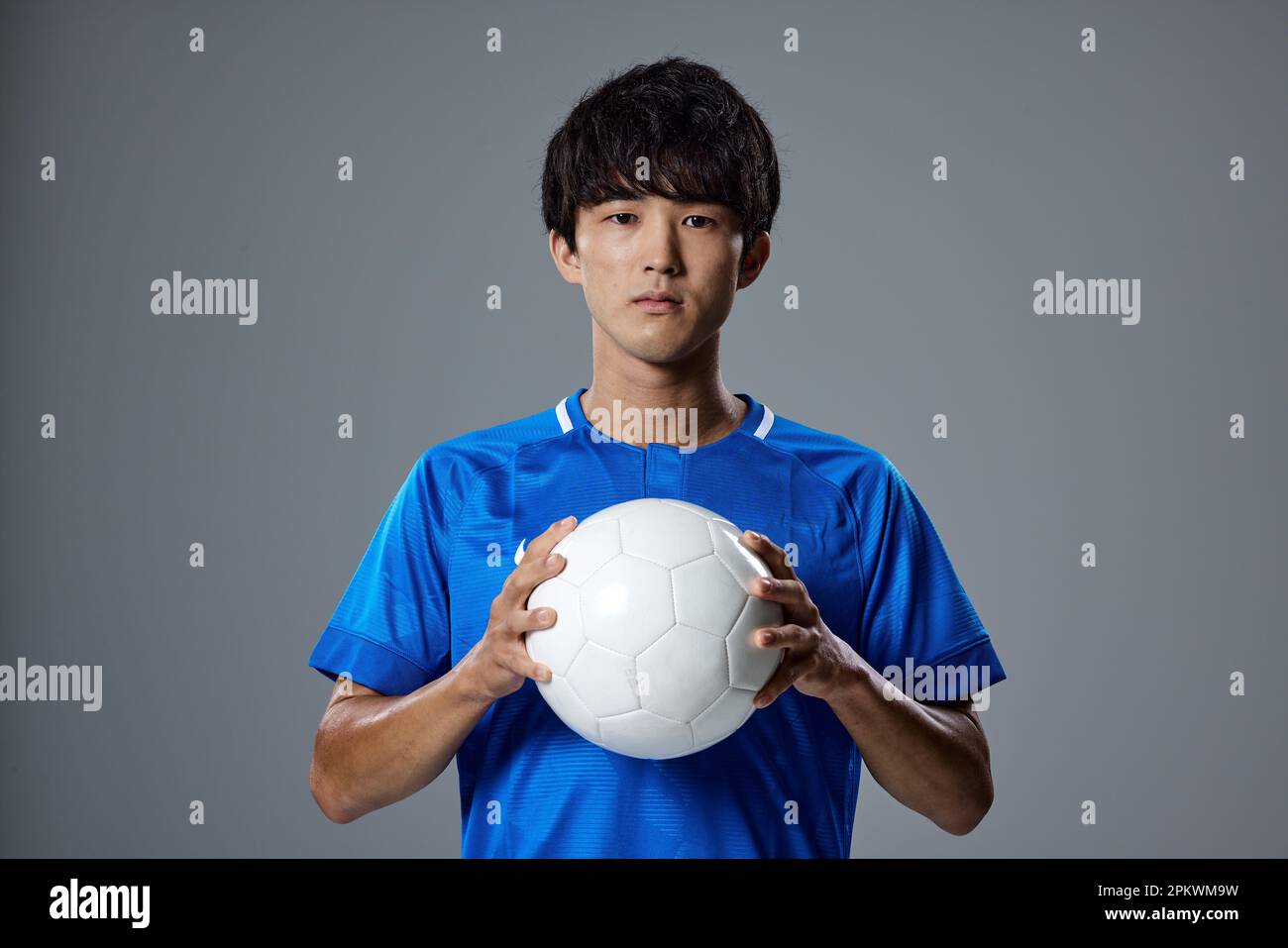 Soccer player studio portrait Stock Photo - Alamy
