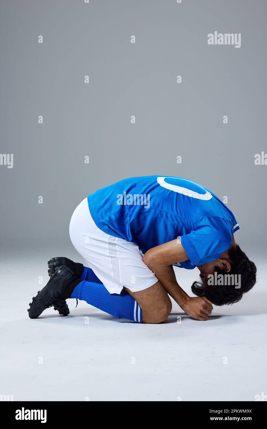 Soccer player studio portrait Stock Photo - Alamy
