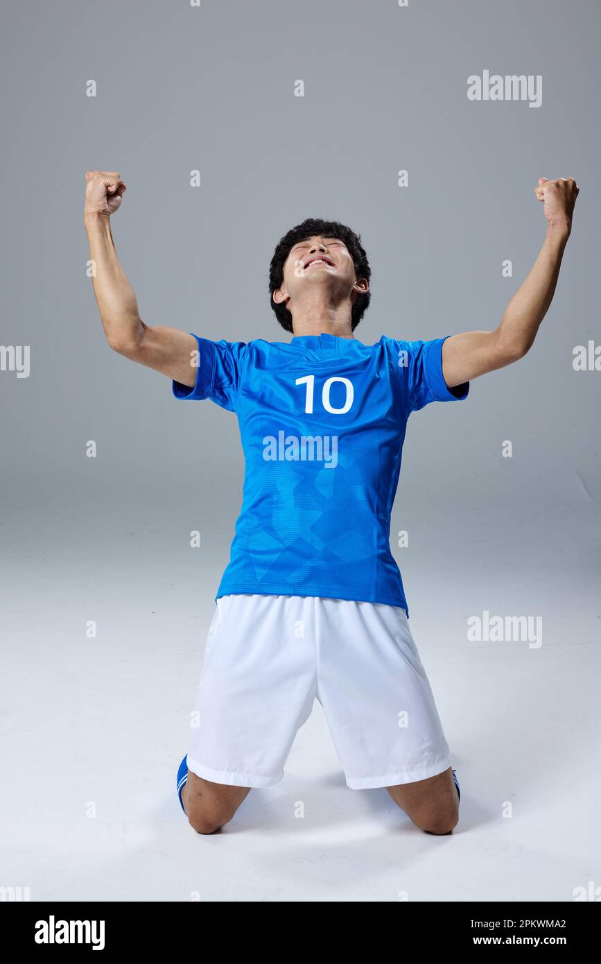 Soccer player studio portrait Stock Photo - Alamy