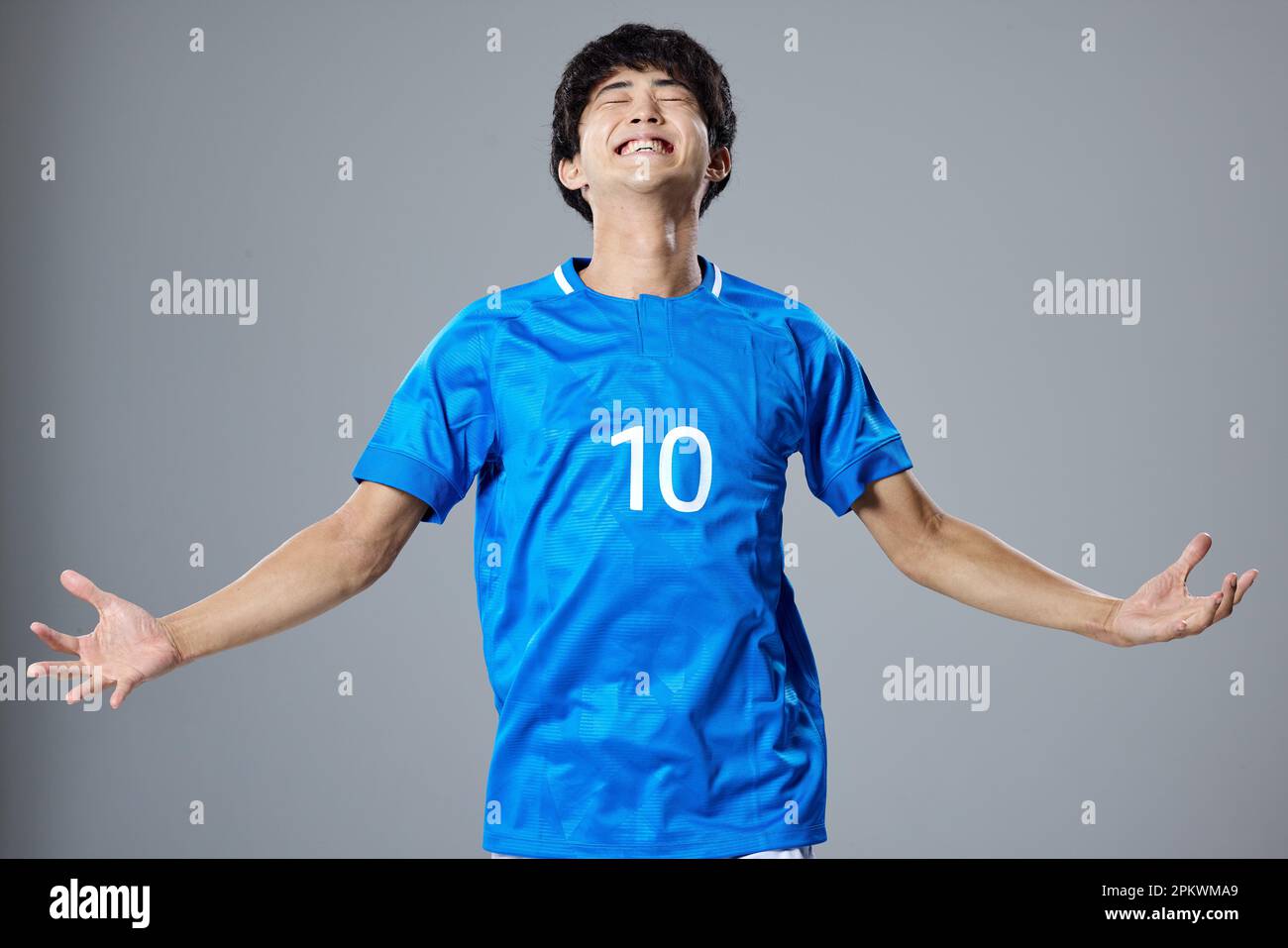Soccer player studio portrait Stock Photo - Alamy