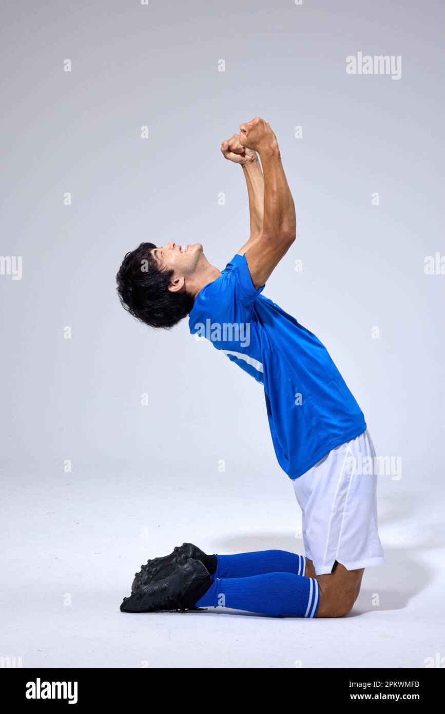 Soccer player studio portrait Stock Photo - Alamy