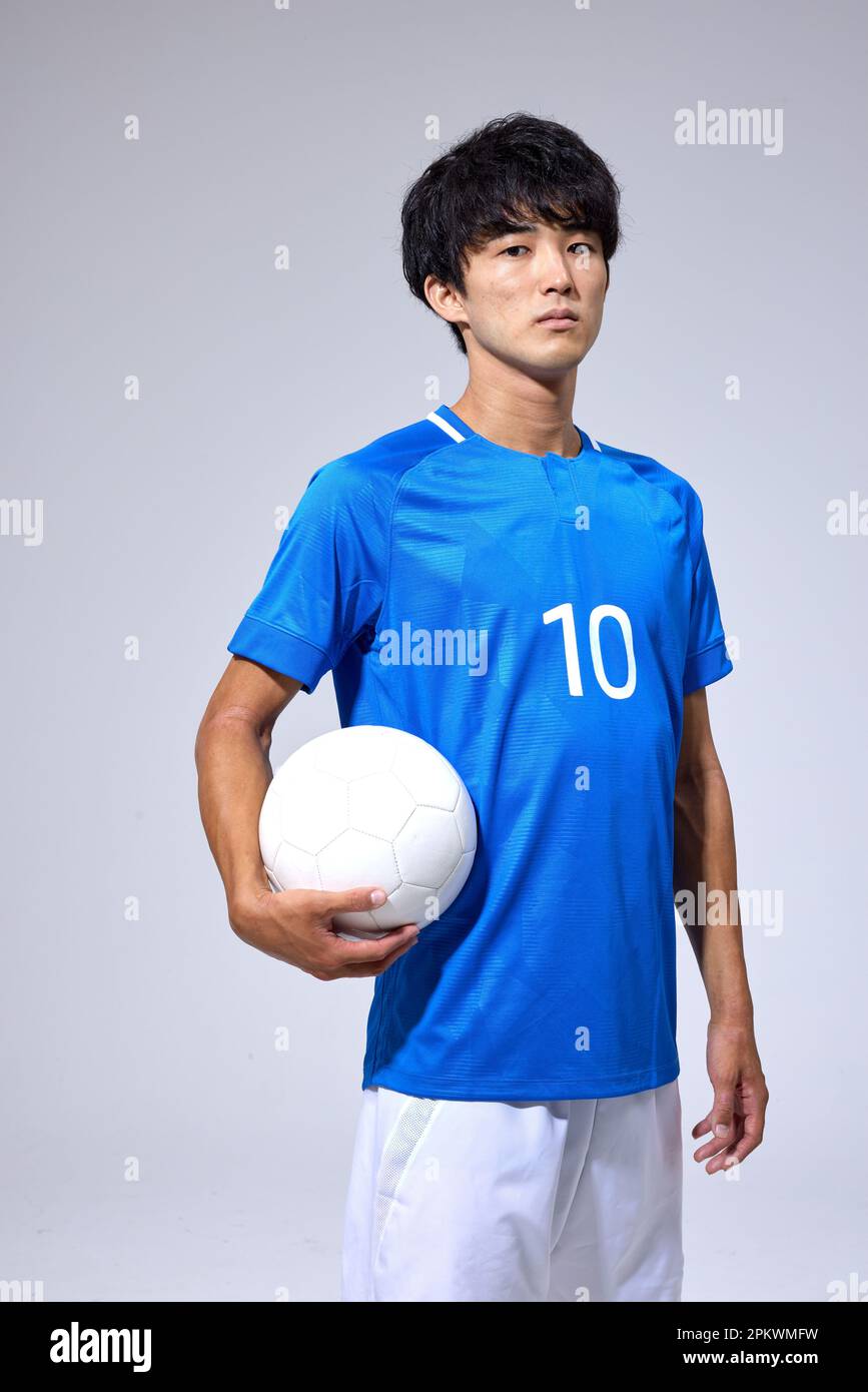 Soccer player studio portrait Stock Photo - Alamy