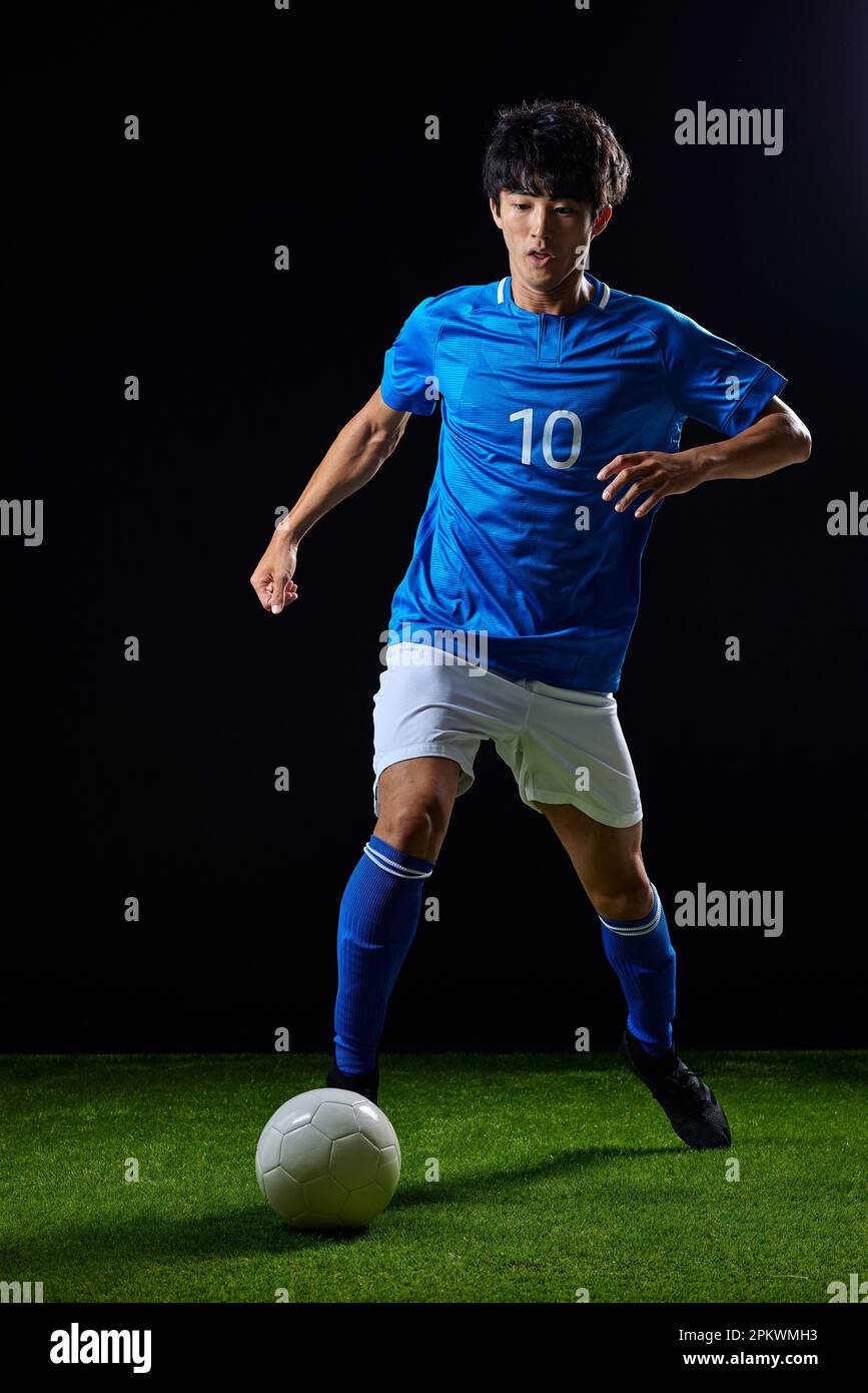 Soccer player studio portrait Stock Photo - Alamy