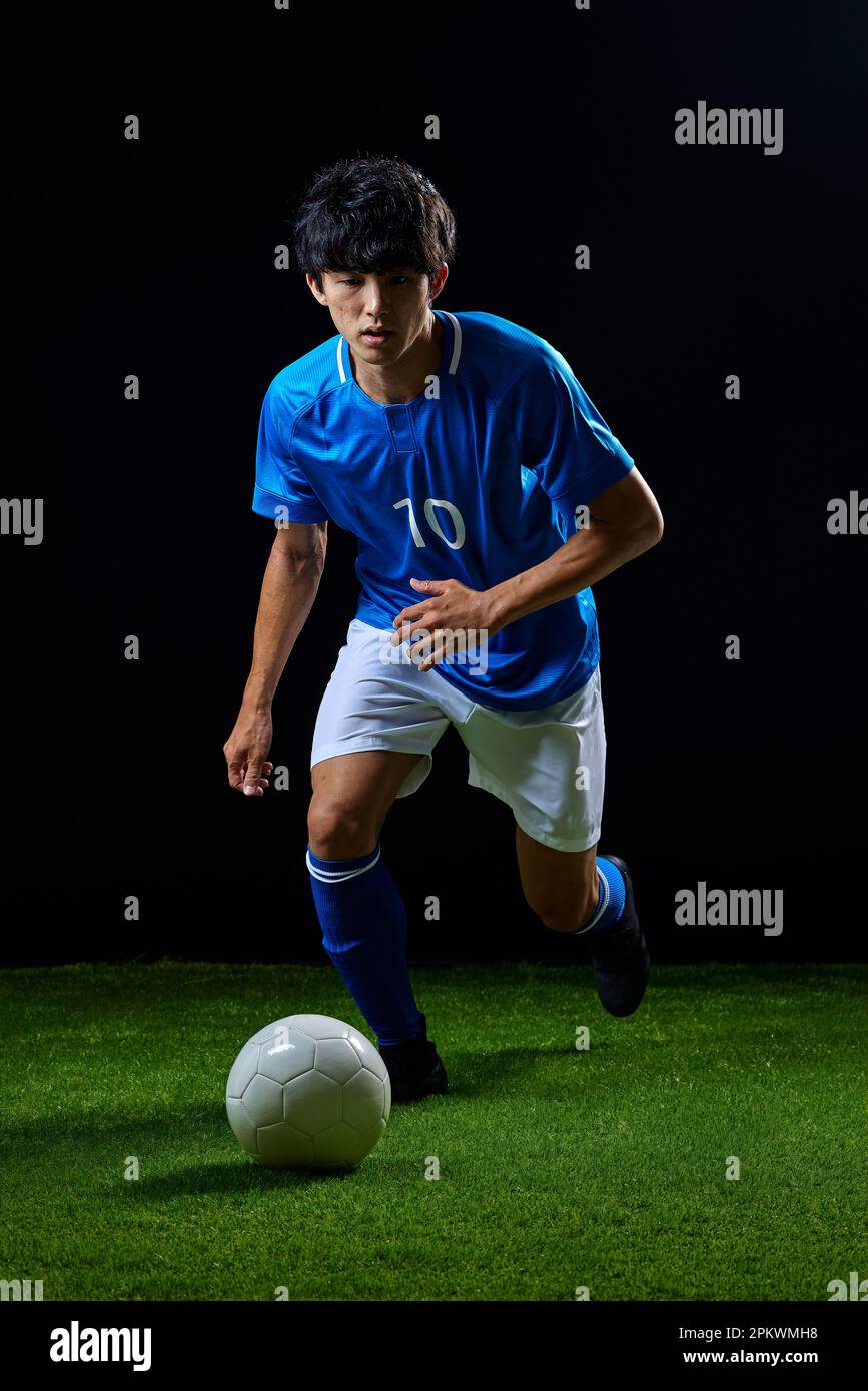 Soccer player studio portrait Stock Photo - Alamy