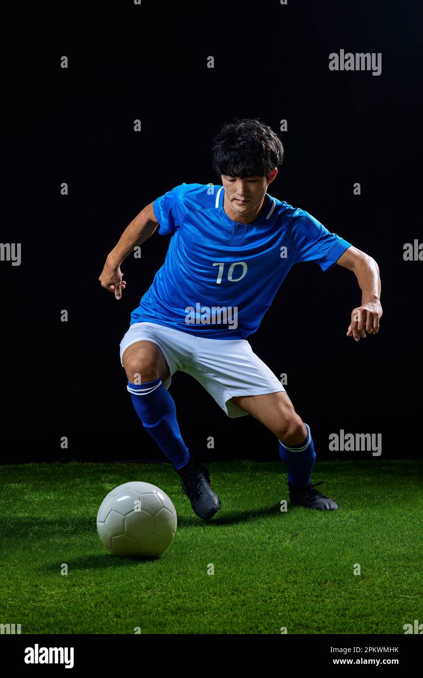 Soccer player studio portrait Stock Photo - Alamy