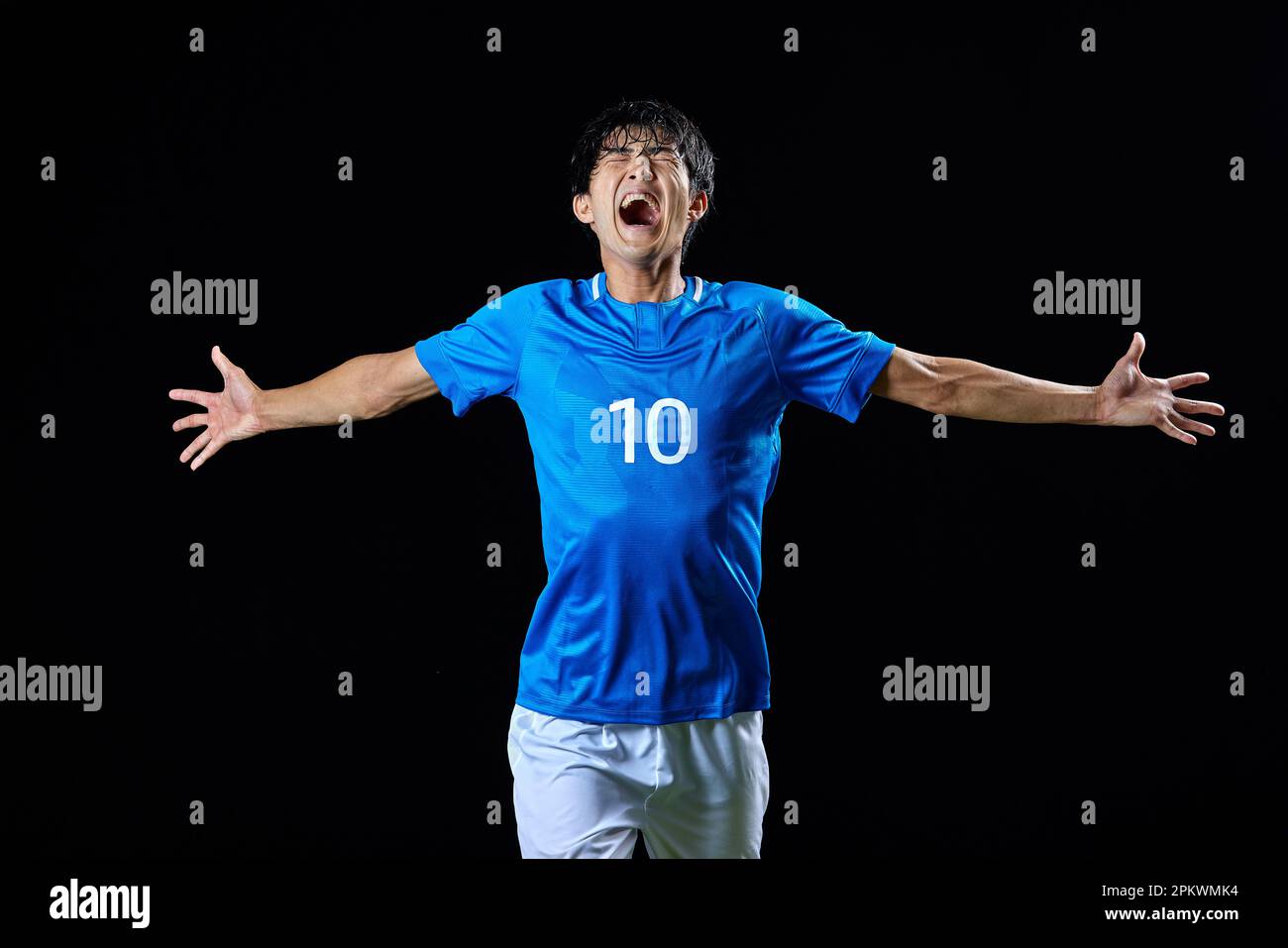 Soccer player studio portrait Stock Photo - Alamy