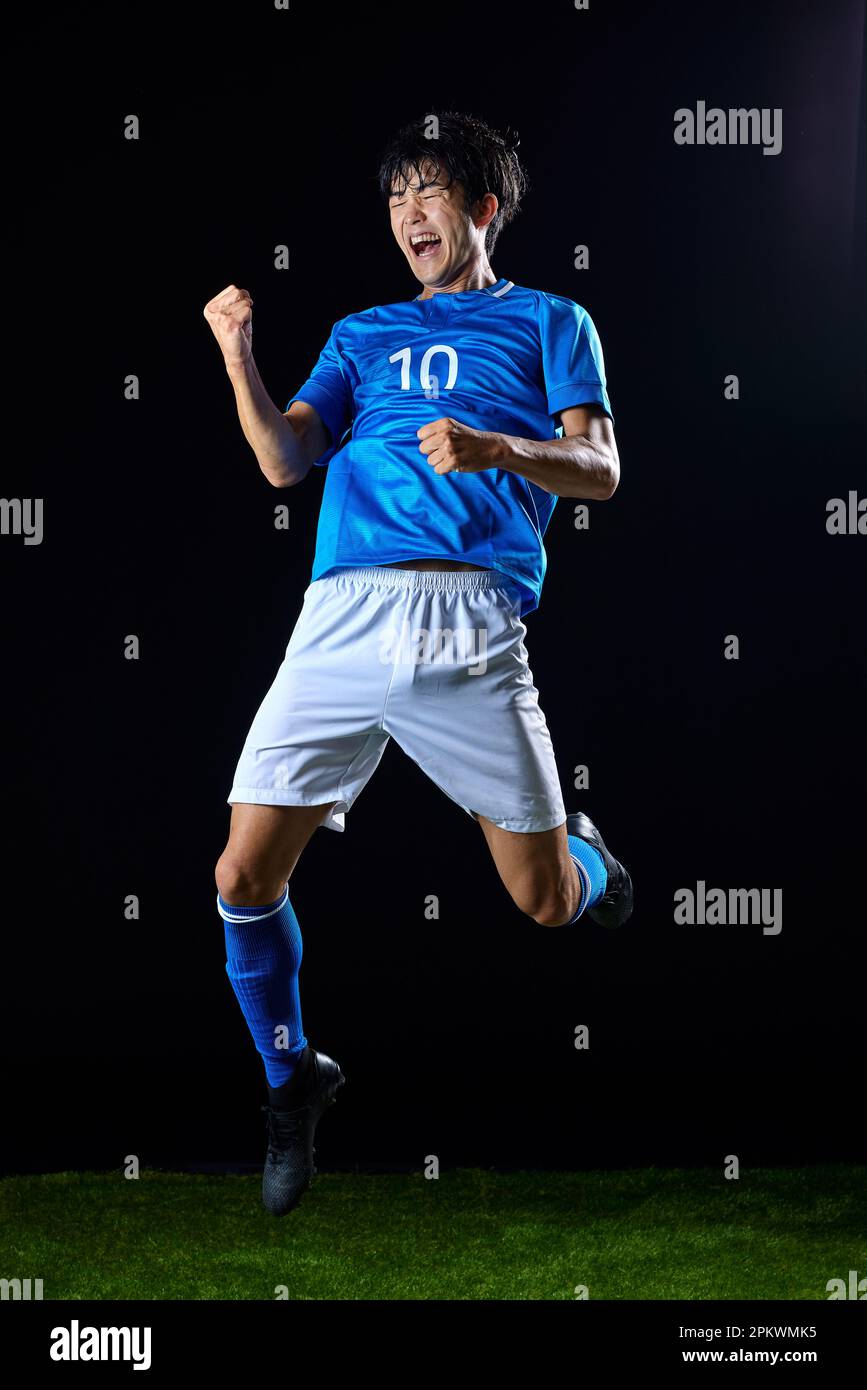 Soccer player studio portrait Stock Photo - Alamy