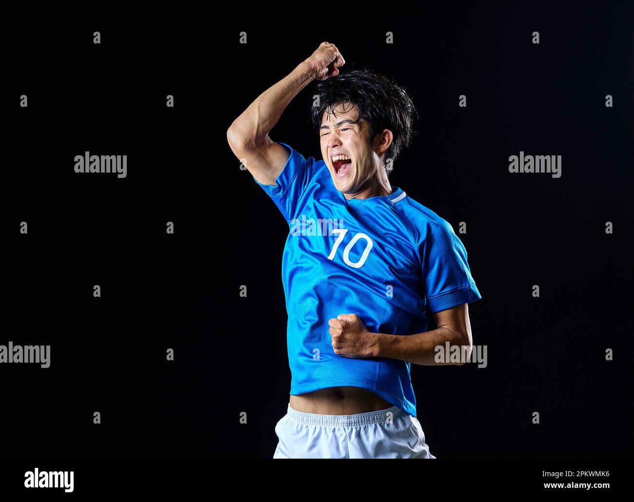 Soccer player studio portrait Stock Photo - Alamy
