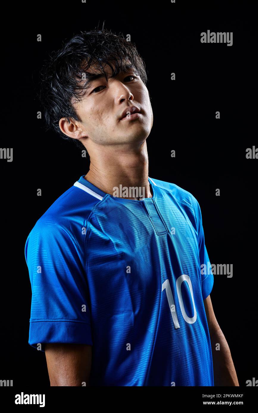 Soccer player studio portrait Stock Photo - Alamy