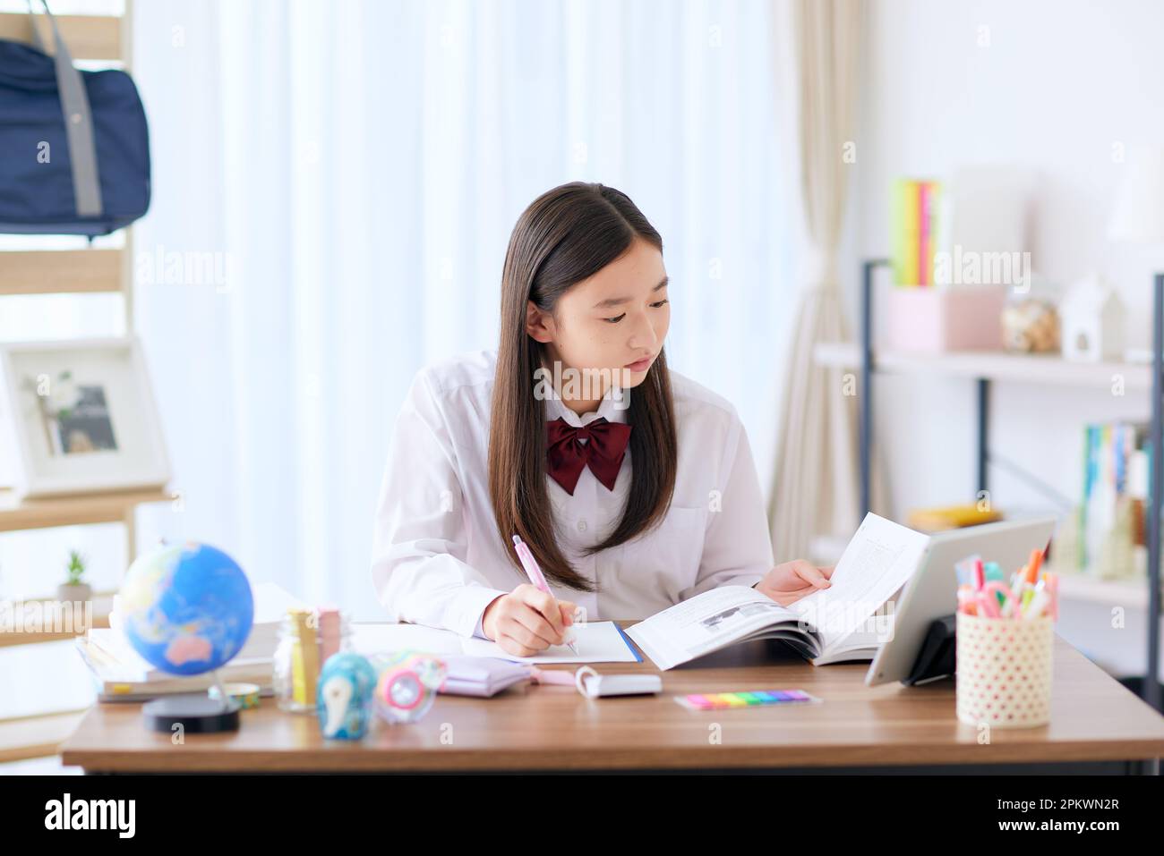 Japanese high school student in uniform studying Stock Photo - Alamy