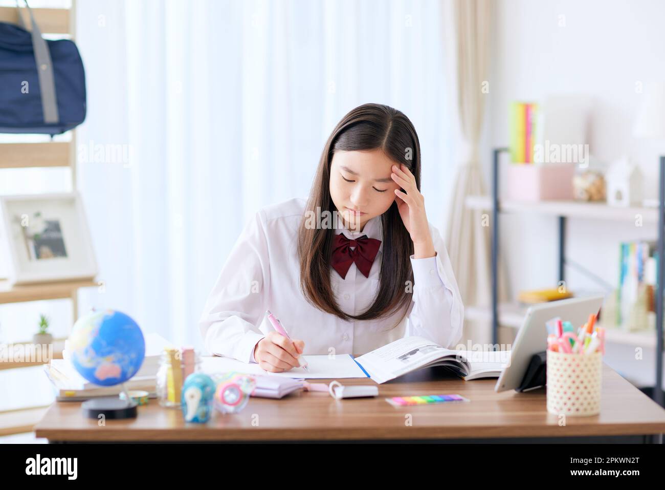 Japanese high school student in uniform studying Stock Photo - Alamy