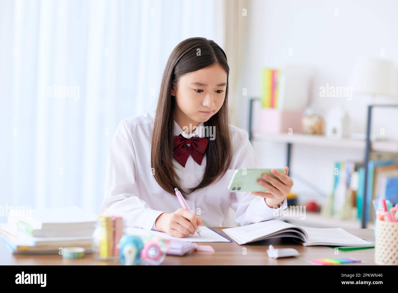 Japanese high school student in uniform studying Stock Photo - Alamy